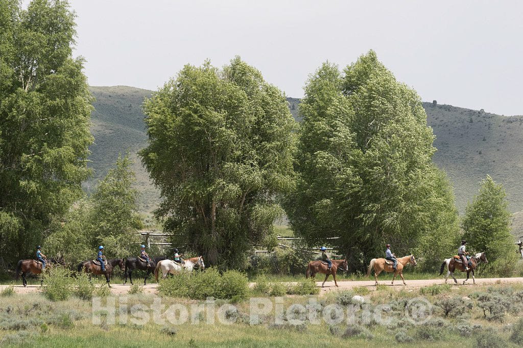 Photo - Horseback riders at the A Bar A guest ranch, just over the Col ...